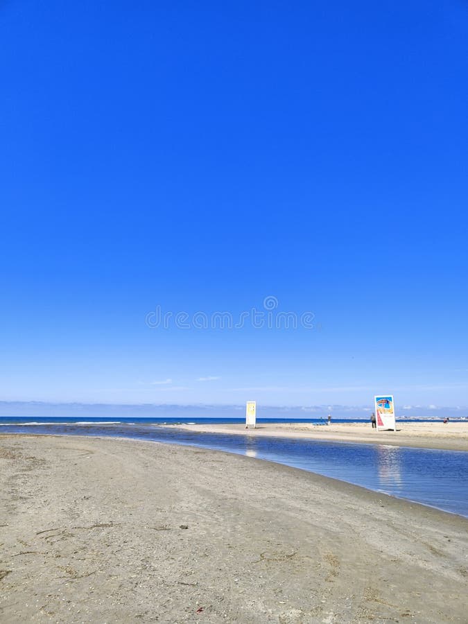The Black Sea in Spring with Waves and Sand on the Beach with a Bright ...