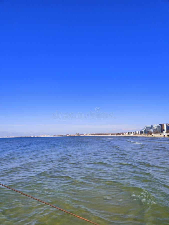 The Black Sea in Spring with Waves and Sand on the Beach with a Bright ...