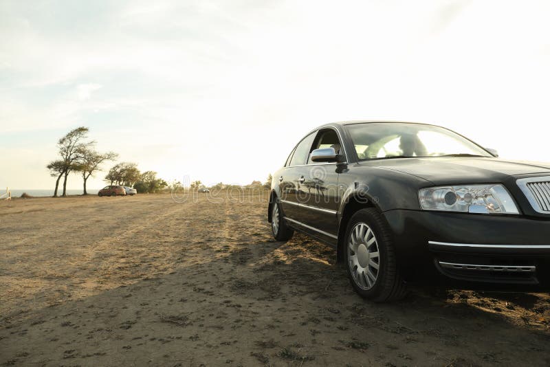 Black Sedan Car Against Sky with Sunlight Stock Image - Image of ...