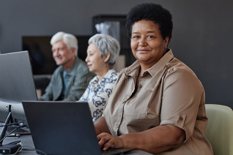 Black Senior Woman in Computer Class for Elderly Smiling at Camera ...
