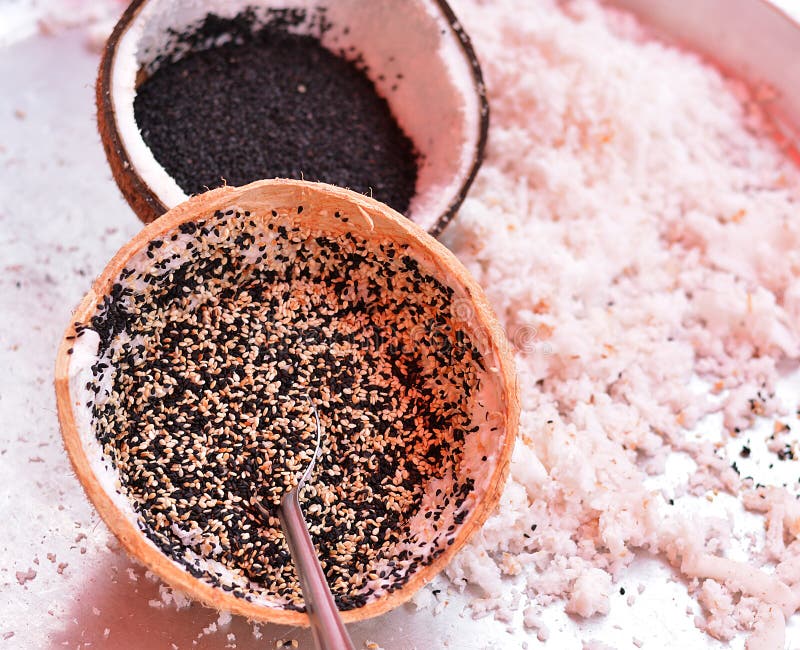 Black Sesame Seeds and White Sesame in Coconut Shell Stock Photo ...