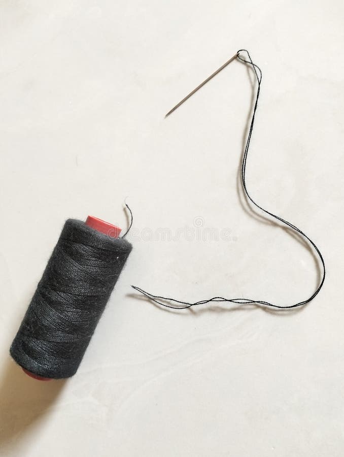 Black Sewing Thread and Needle Done by Hand Stock Image - Image of ...
