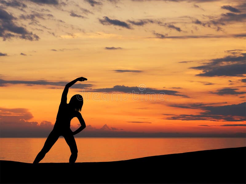A Black Silhouette of a Woman Doing Exercise on a Sunset Stock Photo ...