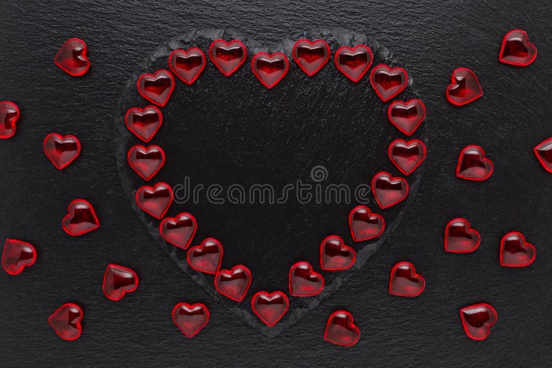 Black Slate Plate with Red Hearts on Black Background Stock Image ...