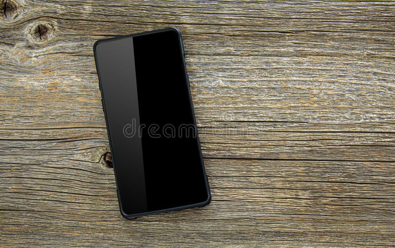 Black Smartphone on Wooden Table. Stock Photo - Image of mobile, smart ...