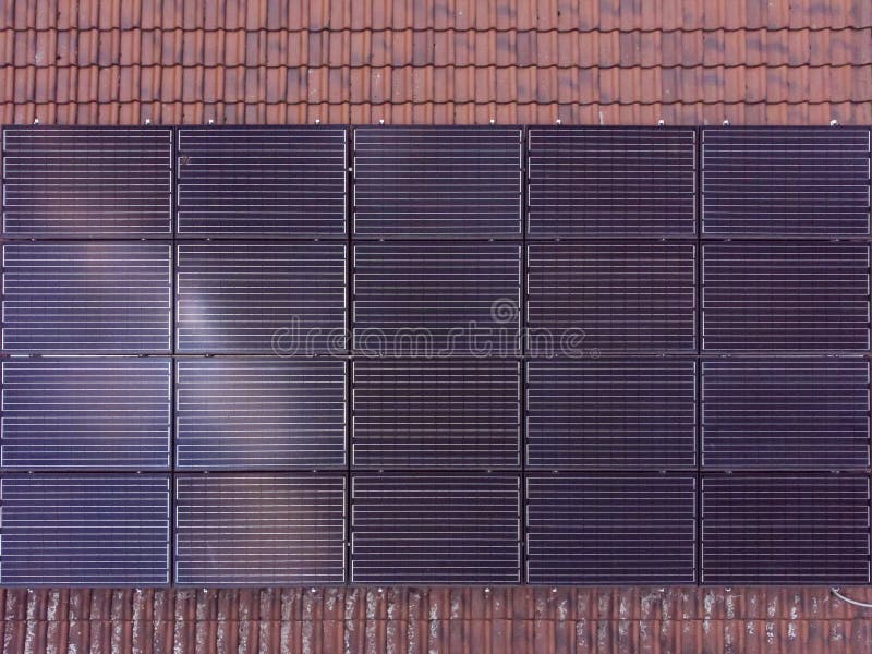 Black Solar Panels in Rectangular Form Installed on a Tiled Roof Stock ...