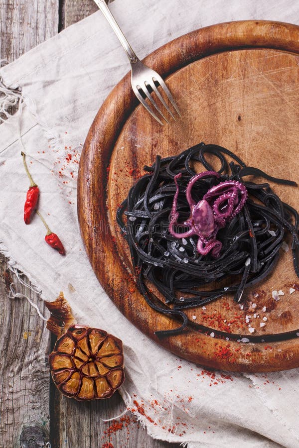 Black Spaghetti with Octopus Stock Photo - Image of board, refreshment ...