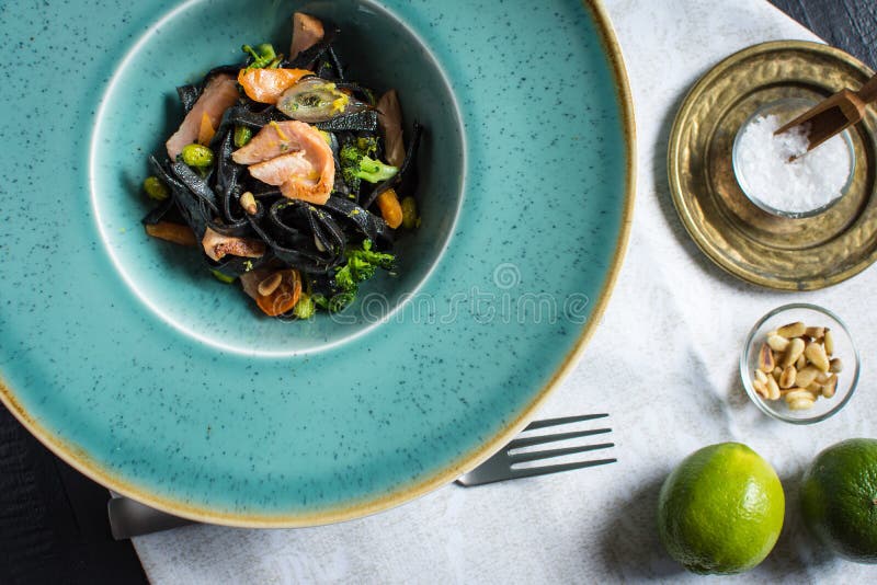 Cuttlefish Ink Black Spaghetti with Salmon and Vegetables Stock Image ...