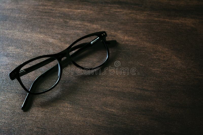 Black Spectacle on Wooden Table Stock Image - Image of line, single ...