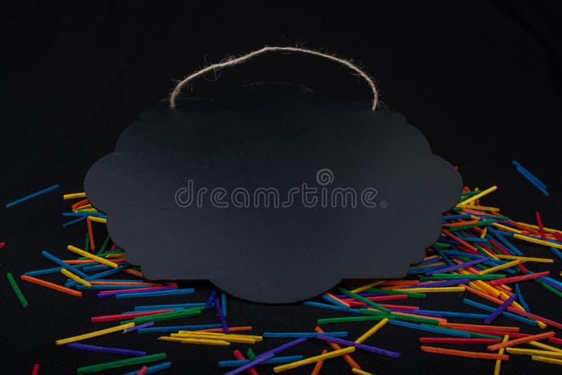Black Speech Bubble Shaped Notice Board on Colorful Sticks Stock Photo ...