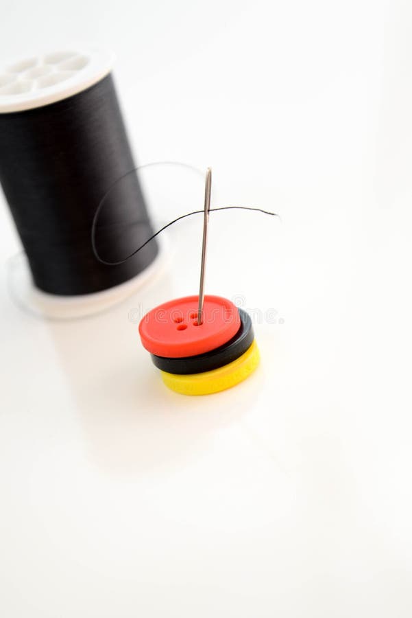 Black Spool of Thread, Needle and Buttons Stock Image - Image of black ...