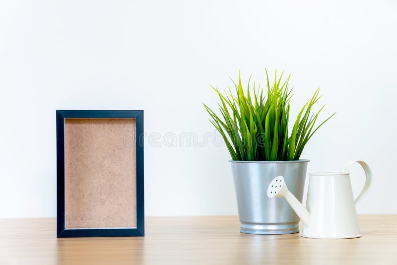 Black Square Frames and Green Plant on Wooden Table Stock Image - Image ...