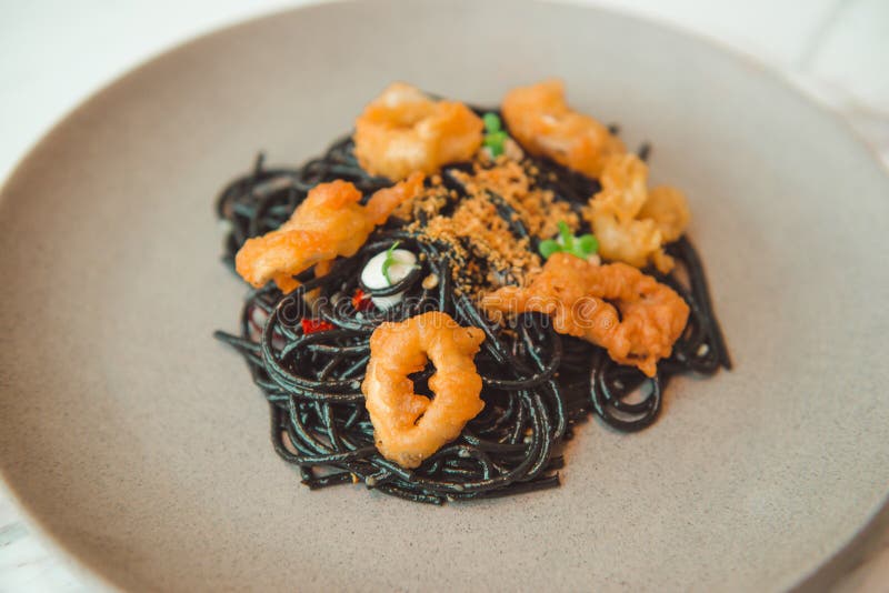 Black Squid Ink Pasta is Paired with Scallops on Pasta Dish Stock Photo ...