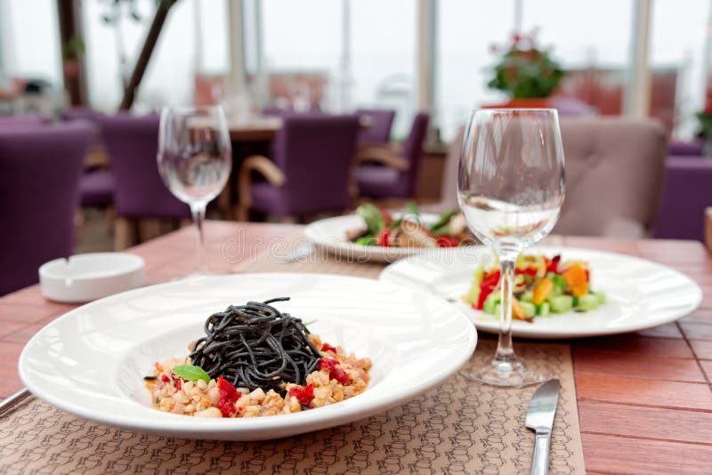 Black Squid Ink Pasta with Seafood and Other Dishes Stock Image - Image ...