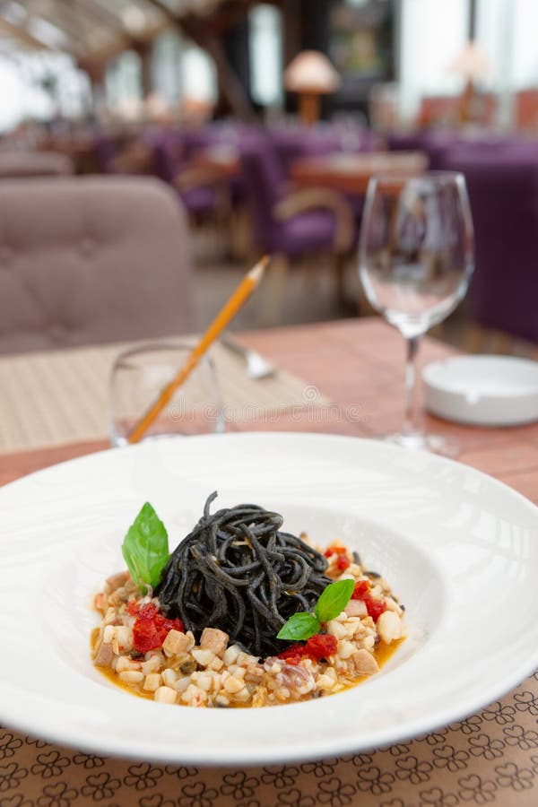 Black Squid Ink Pasta with Seafood on Table Stock Photo - Image of ...
