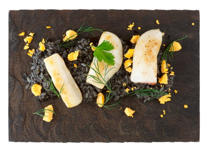 Black Squid Ink Risotto with Seared Calamar Stock Photo - Image of ...