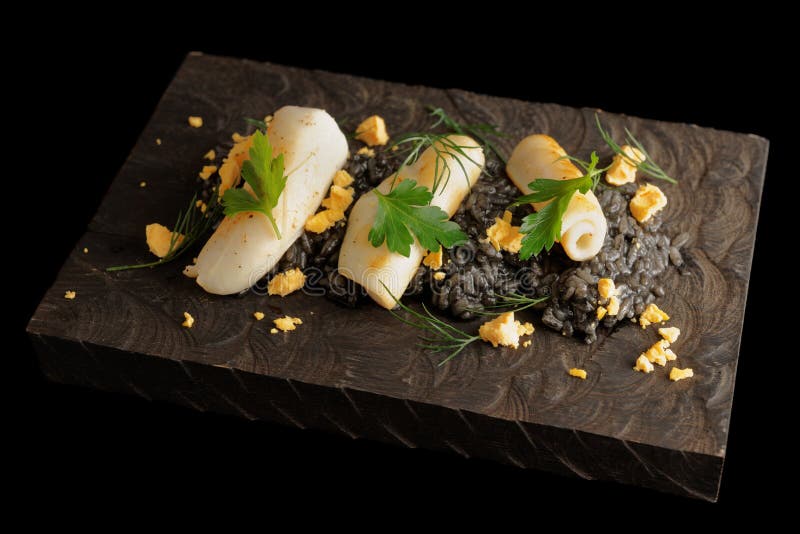 Black Squid Ink Risotto with Seared Calamary Stock Photo - Image of ...