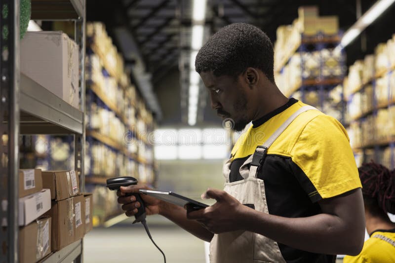 Black Staff Member Using a Barcode Scanner To Process Shipping Labels ...