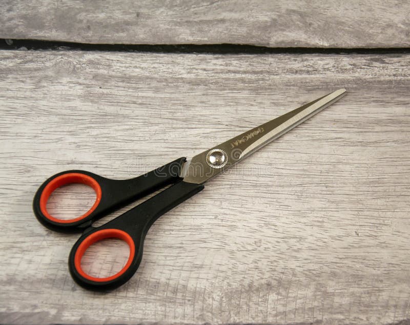 Black Steel Office Scissors in Hand.Grey Background. Stock Photo ...