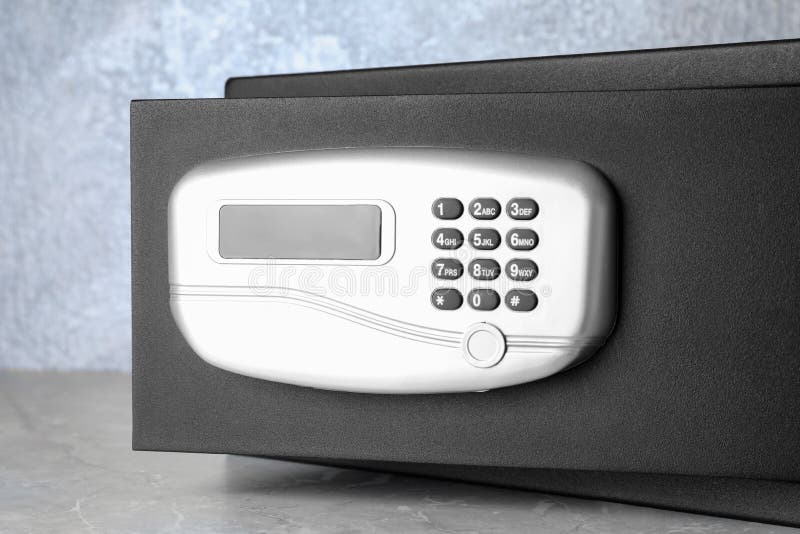 Black Steel Safe with Electronic Lock on Grey Marble Table, Closeup ...