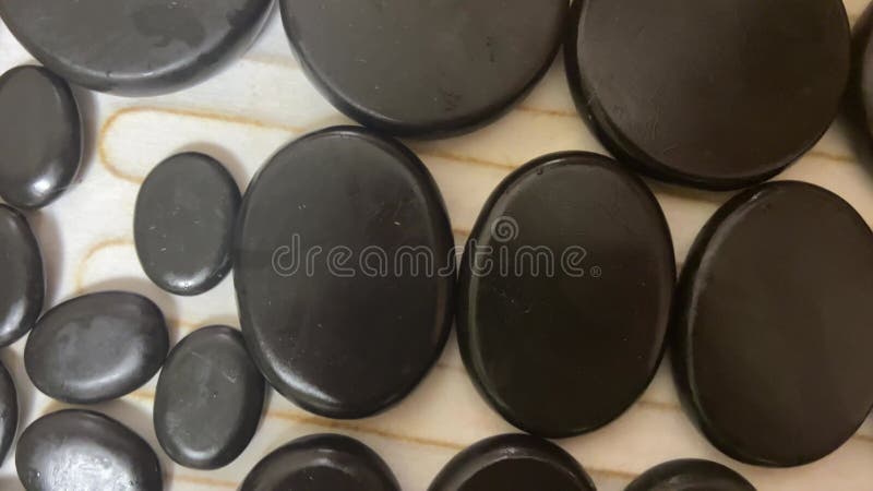 Black Stones for the Hot Stone Massage in the Box. Spa Salon Stock ...