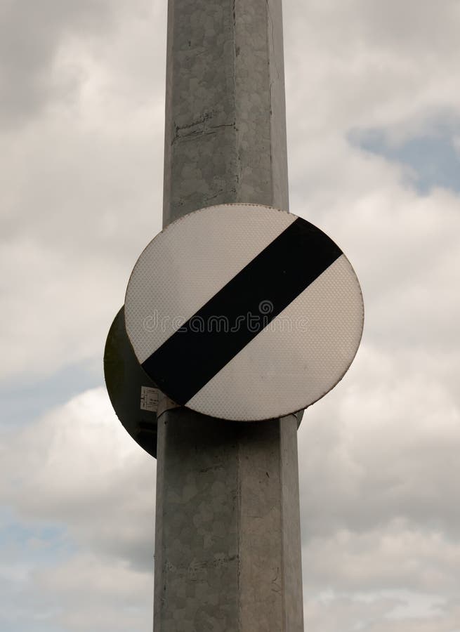 A Black Stripe Line Circle Driving Sign on Metal Post Stock Image ...