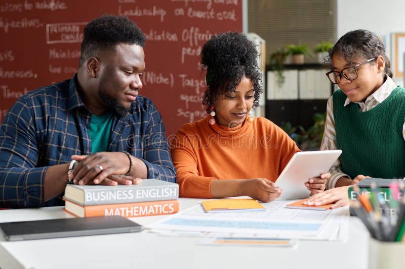 Black Students Using Tablet in Class and Working on Online Presentation ...
