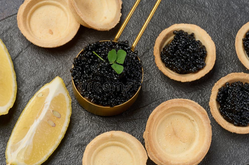 Black Sturgeon Caviar and Empty Round Tartlets on Table, Top View Stock ...