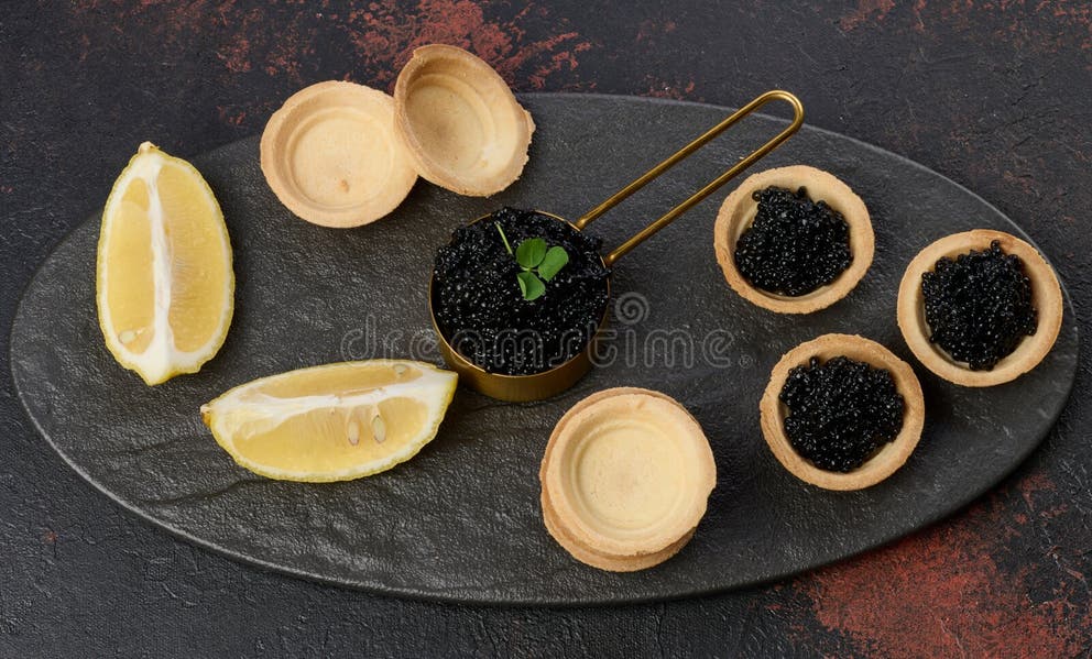 Black Sturgeon Caviar and Empty Round Tartlets on Table, Top View Stock ...