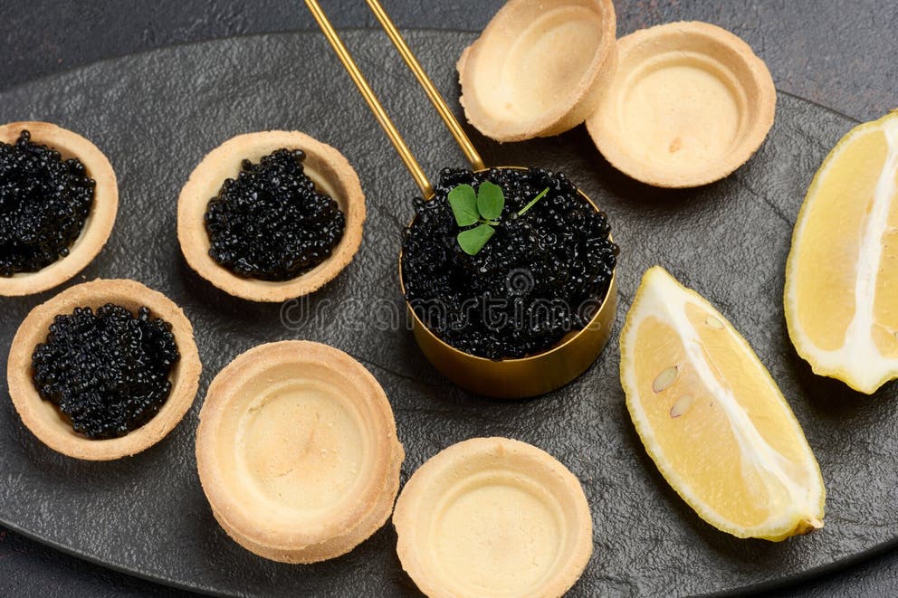 Black Sturgeon Caviar and Empty Round Tartlets on Table, Top View Stock ...