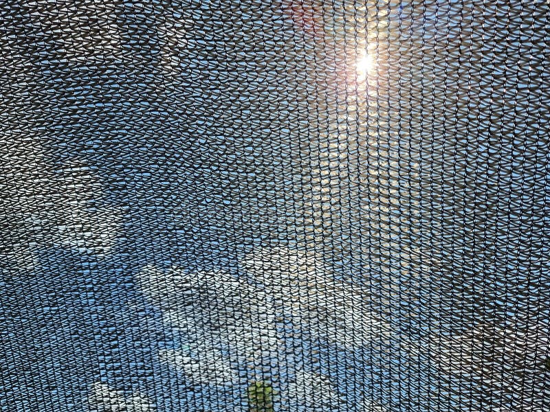 Black Sun Shade Net. the White Clouds and the Sun Could Not Be Seen ...