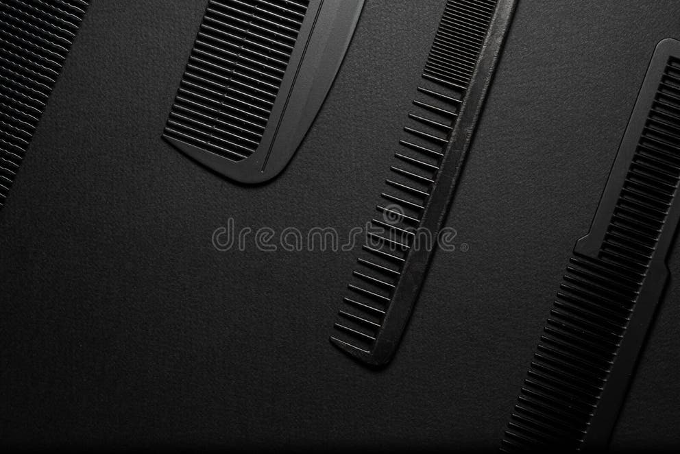 On a Black Surface are Old Barber Tools. Barber Tools. Four Comb. Black ...