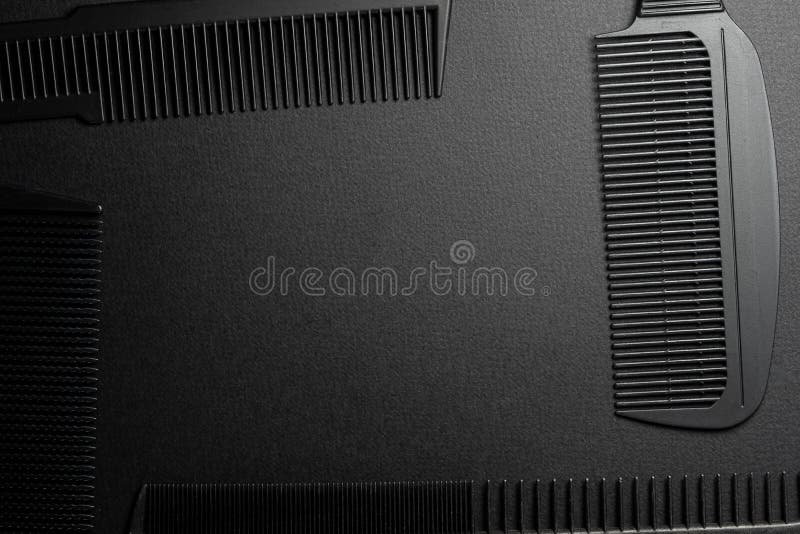 On a Black Surface are Old Barber Tools. Barber Tools. Four Comb. Black ...