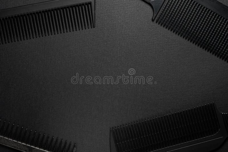 On a Black Surface are Old Barber Tools. Barber Tools. Four Comb. Black ...