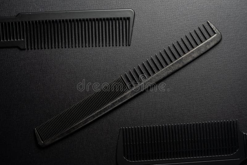 On a Black Surface are Old Barber Tools. Barber Tools. Three Comb ...