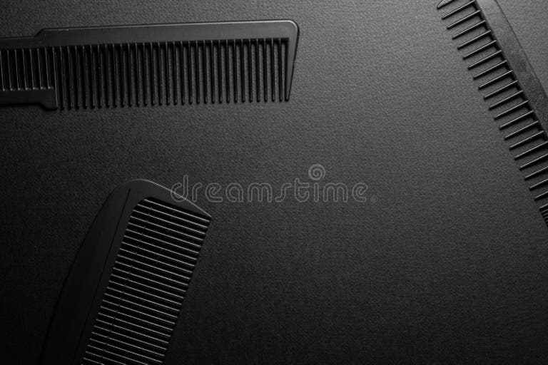 On a Black Surface are Old Barber Tools. Barber Tools. Three Comb ...