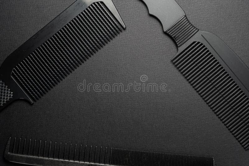 On a Black Surface are Old Barber Tools. Barber Tools. Three Comb ...