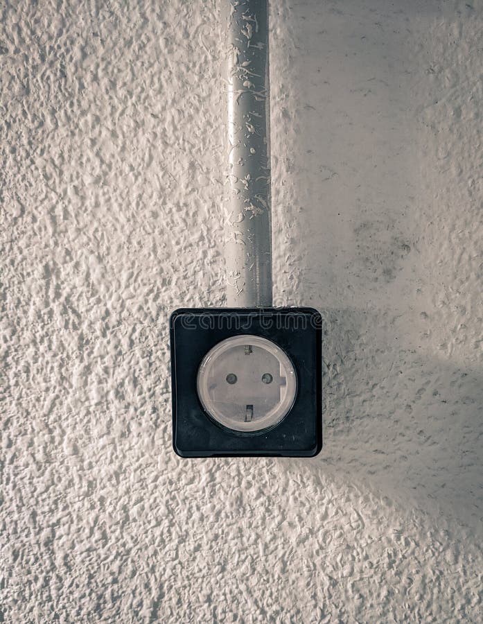 Black Surface Plug on Wall in Garage Stock Photo - Image of ground ...