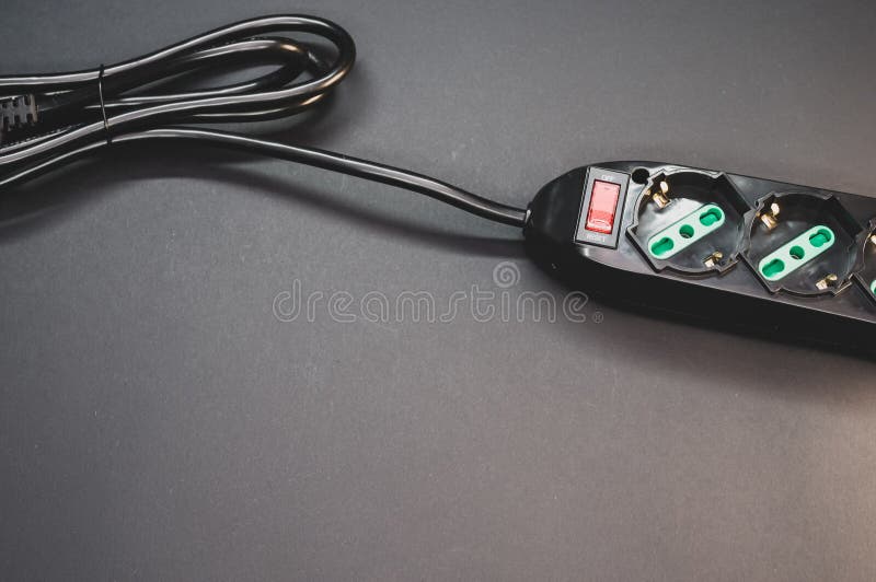 Black Surge Protector on a Black Background Stock Photo - Image of ...
