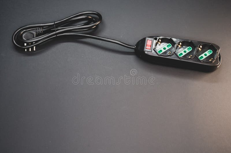 Black Surge Protector on a Black Background Stock Photo - Image of ...
