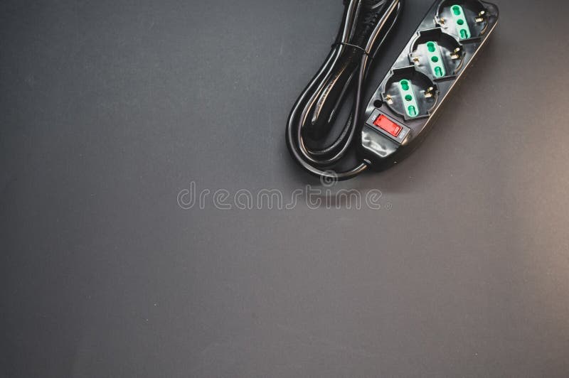 Black Surge Protector on a Black Background Stock Photo - Image of ...