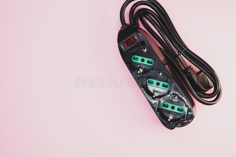 Black Surge Protector on a Light Pink Background Stock Image - Image of ...