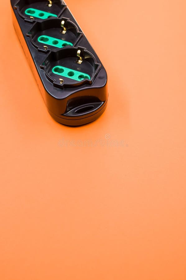 Black Surge Protector on an Orange Background Stock Image - Image of ...