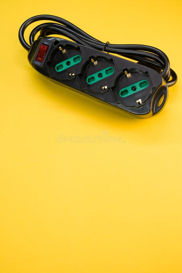 Black Surge Protector on a Yellow Background Stock Image - Image of ...