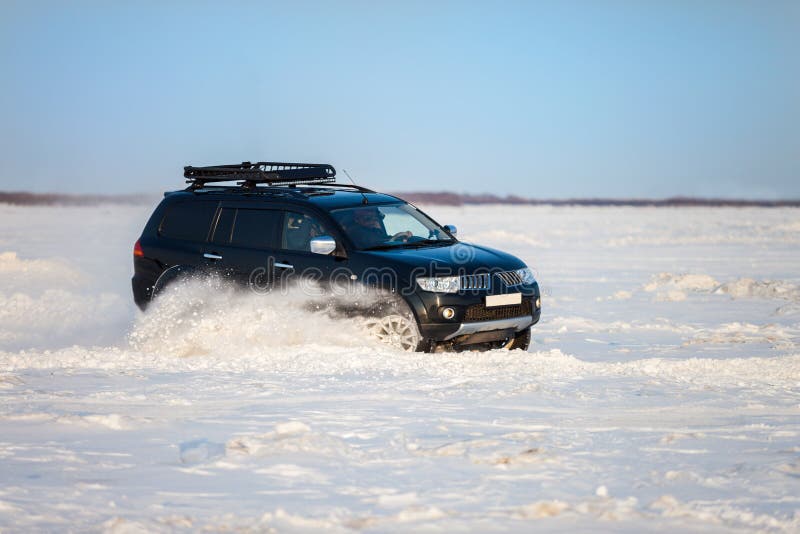 Black SUV Moving Fast on Snow Stock Photo - Image of speed, transport ...