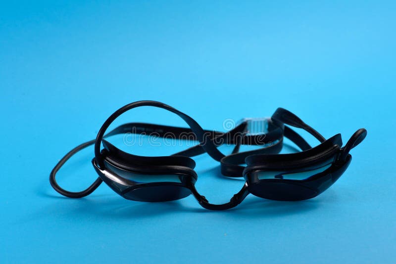 Black Swimming Goggles on Blue Stock Photo - Image of close, laying ...