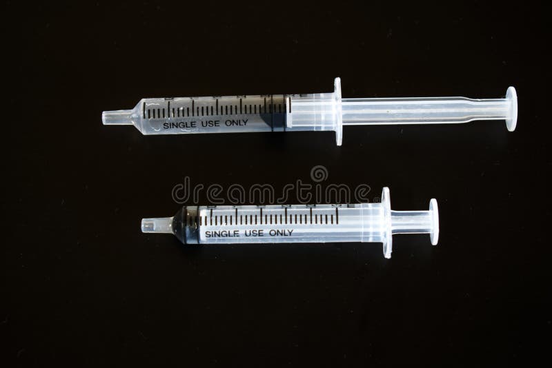 Black Syringe on a Beautiful Black Background. Stock Photo - Image of ...