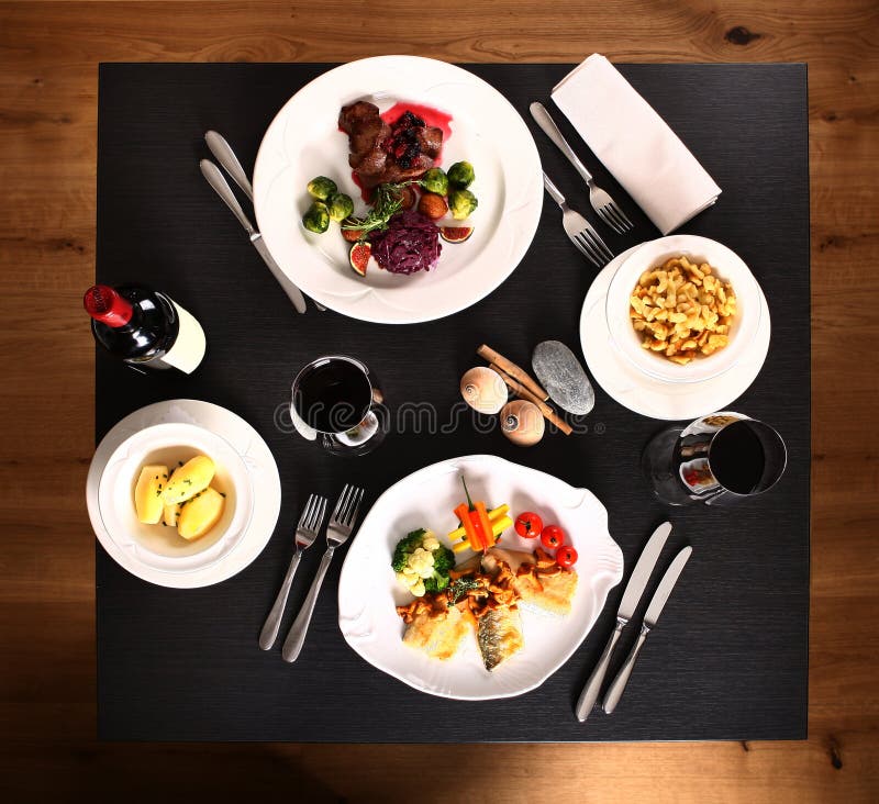 Table with 4 Plates and Wine Stock Photo - Image of four, plate: 169117192