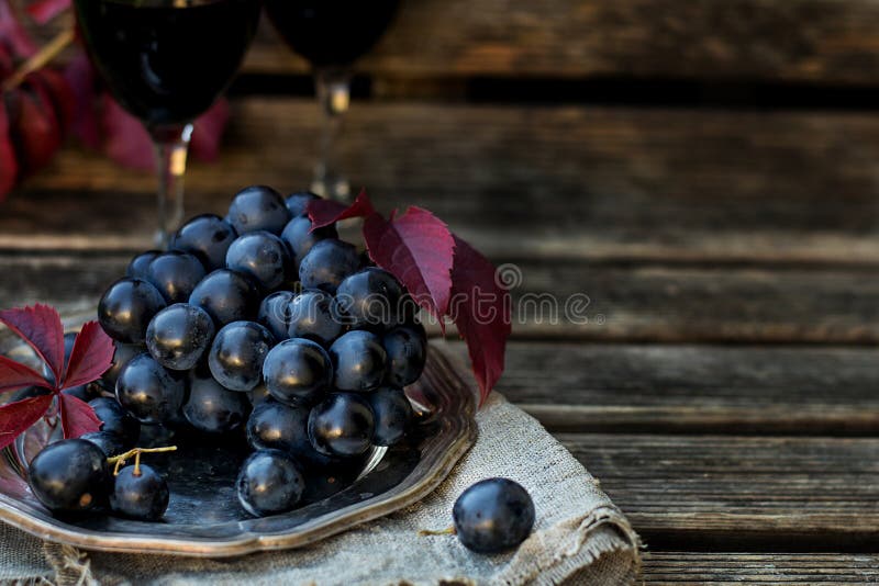 Black Table Grapes on Plate with Black Wine Stock Photo - Image of ...