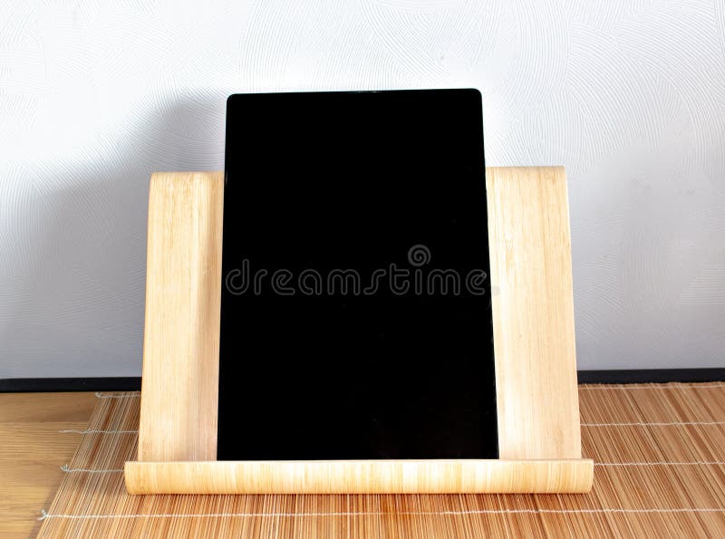 Black Tablet on Table Stand in Simple Setup Stock Image - Image of ...